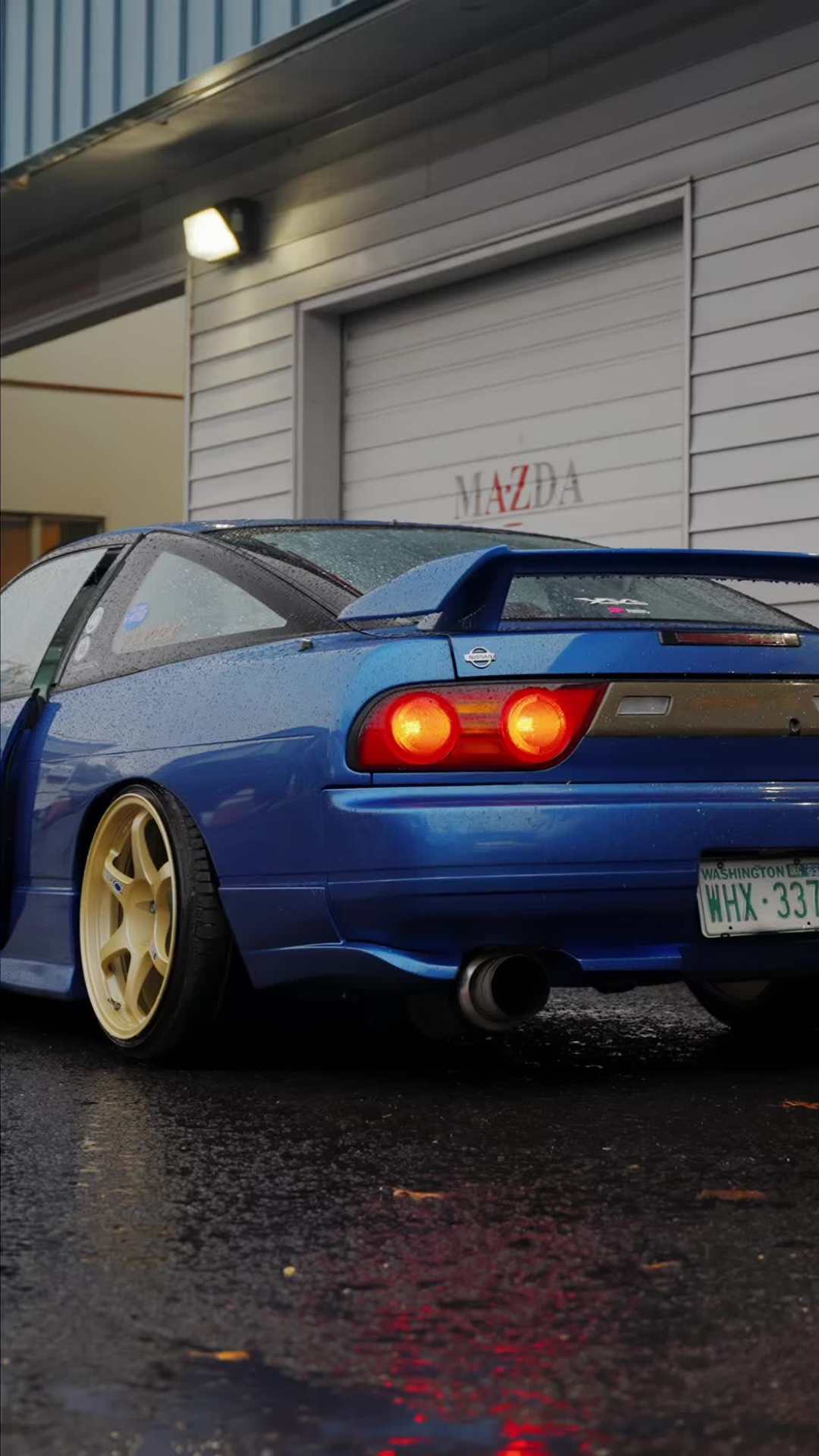 Why this blue car spoiler design stands out in wet conditions