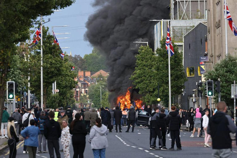 Bus torched as anti-immigration protests erupt after stabbing attack in ...