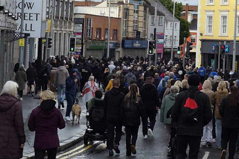 Crowds protest in Lisburn city centre following brutal knife attack in ...