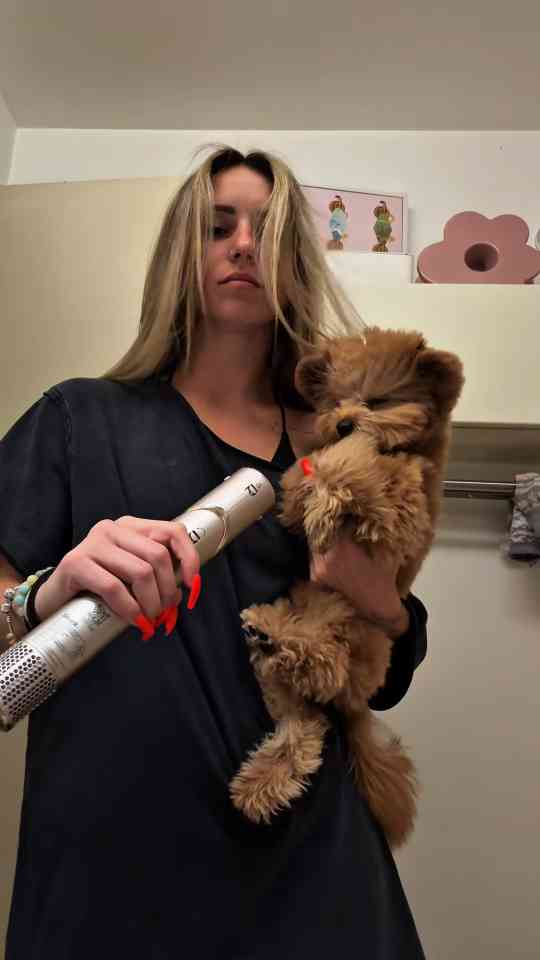 Barney the Pomapoo sings along with his mum