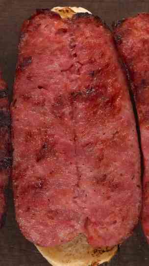 From raw sausage to crusty bread, assembling choripán on a street grill