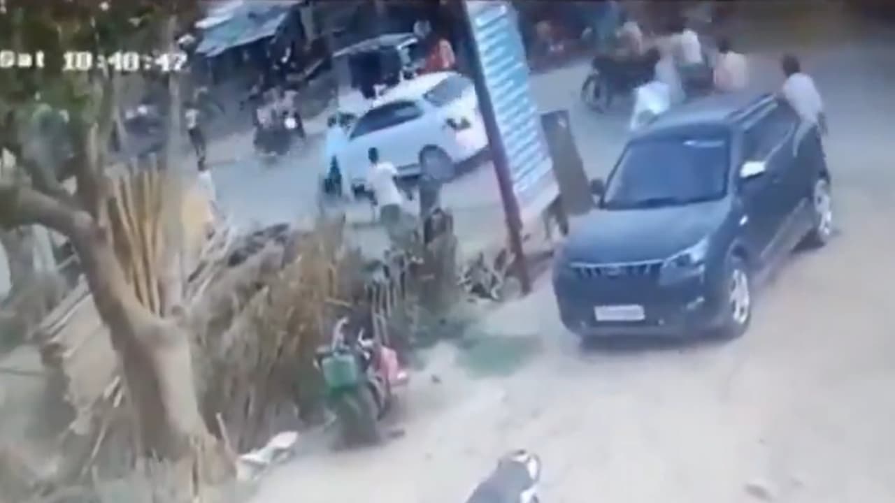 UP woman spots husband with another lady, clings onto his car, dragged ...
