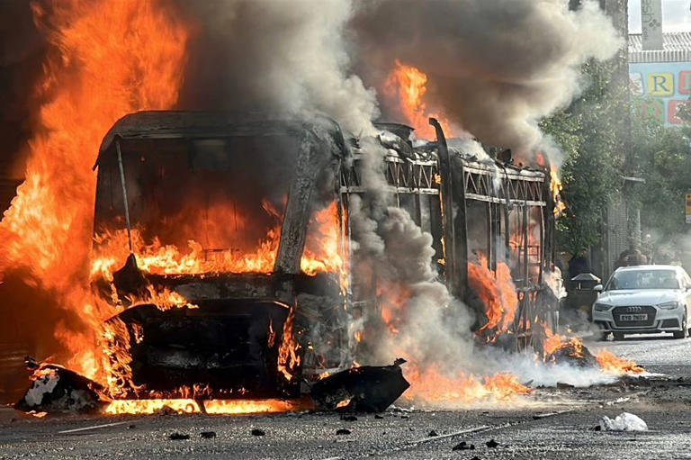 Bus torched as anti-immigration protests erupt after stabbing attack in ...
