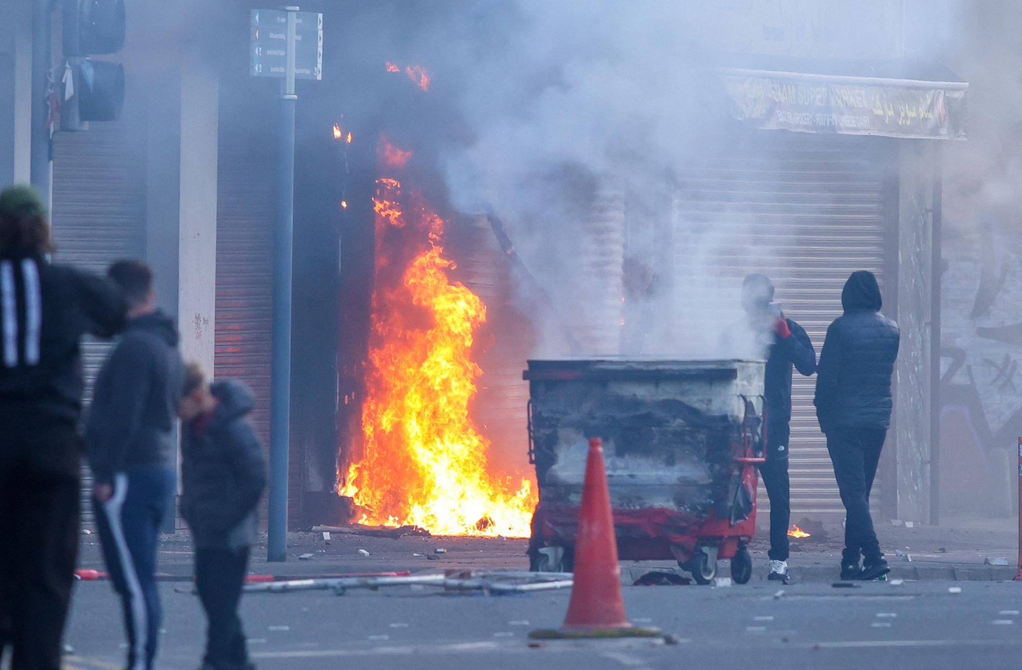 Belfast violence: Ministers condemn attacks as masked gangs roam streets