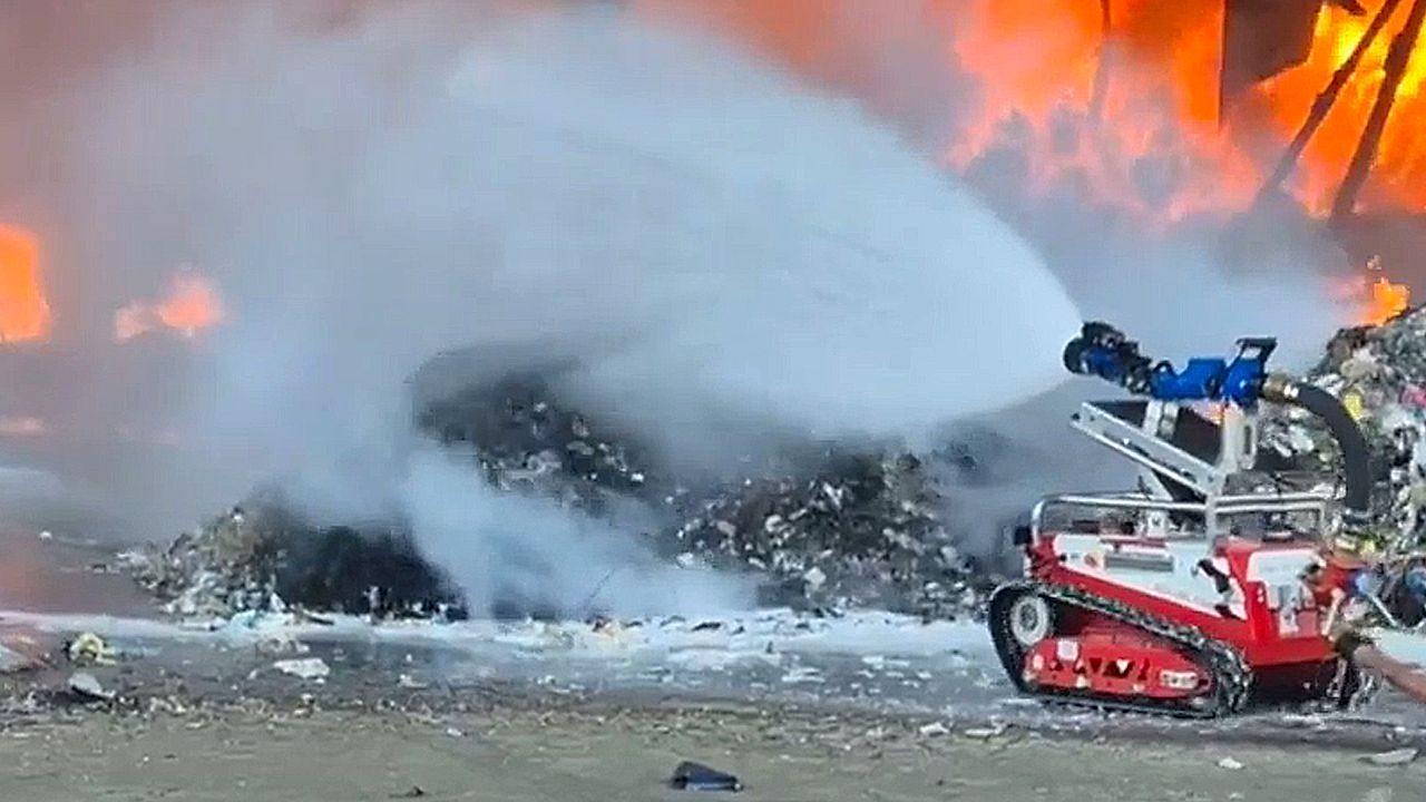 Firefighters in Italy use robot to battle massive warehouse fire