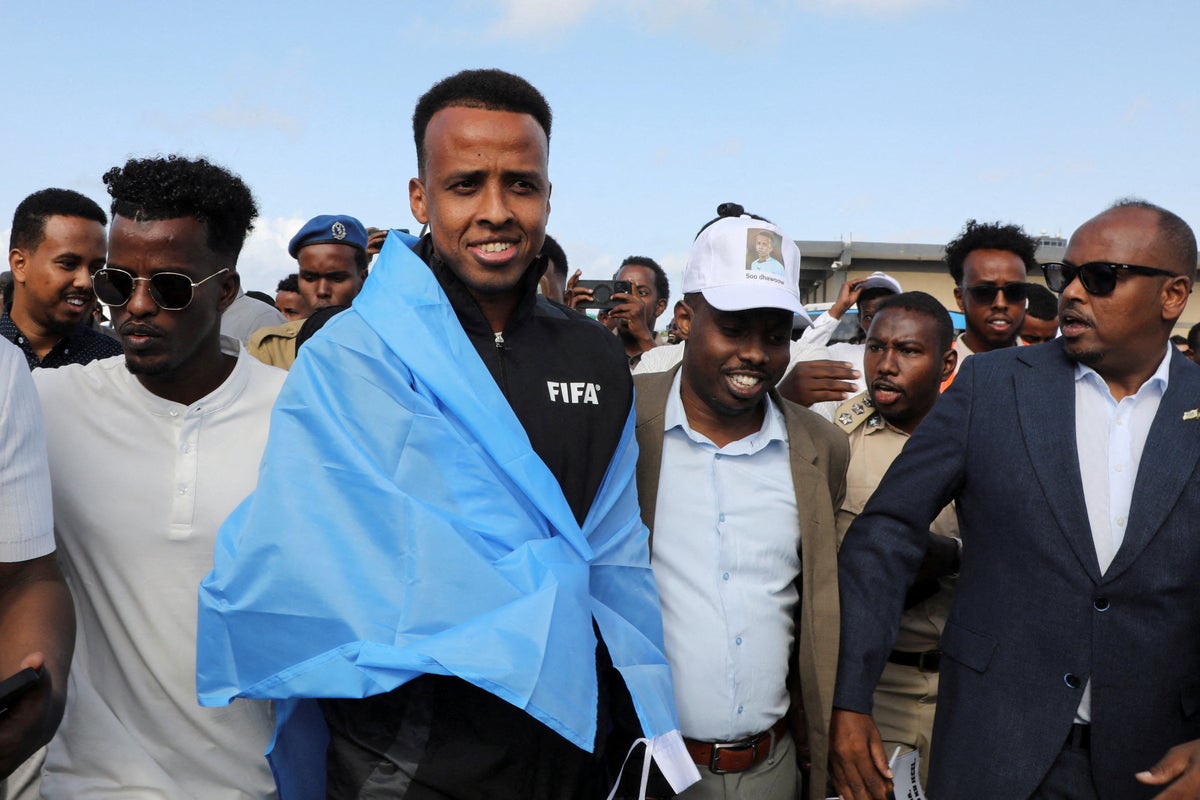 World Cup referee denied entry to US arrives home to hero’s welcome