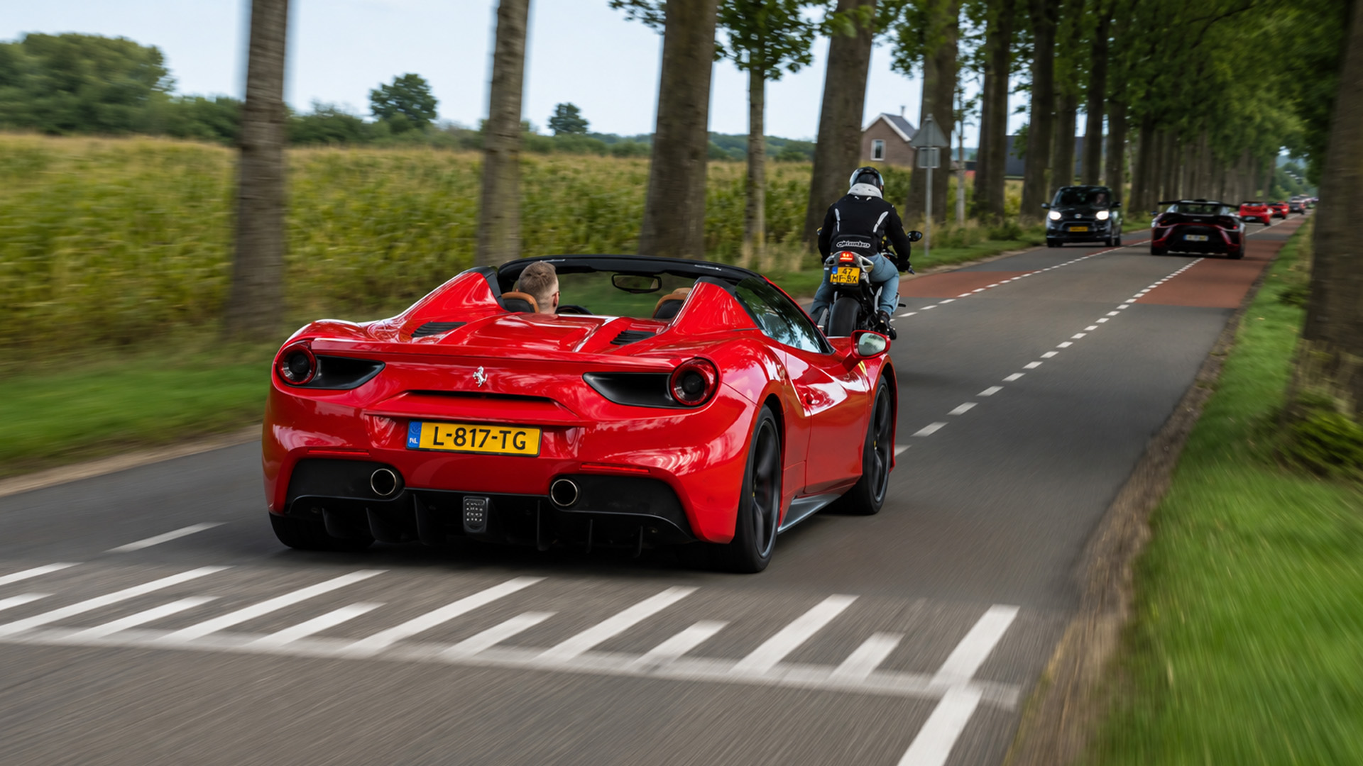 Ferrari 488 Spider nearly hits motorcycle on narrow road
