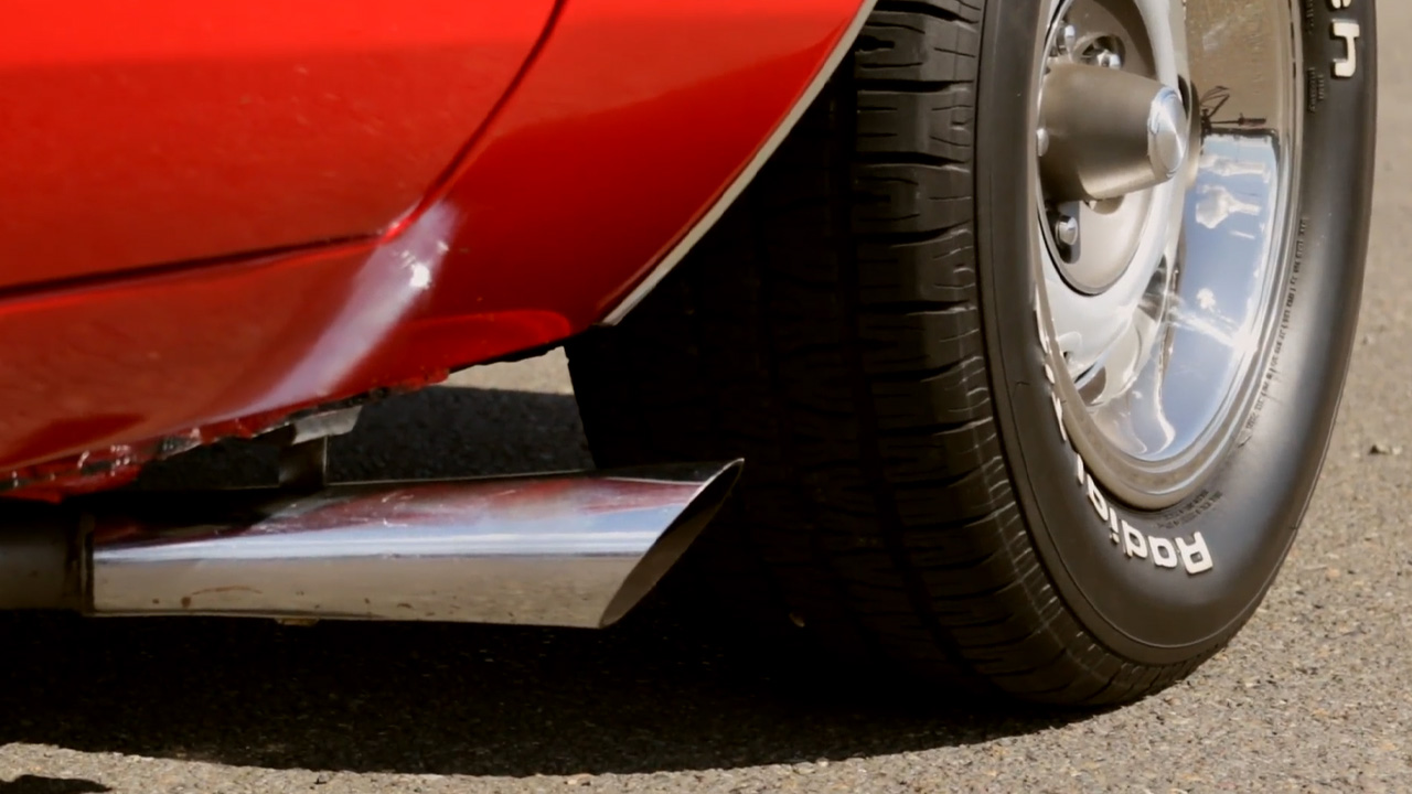 Classic Plymouth Cuda AAR features unique side exit exhaust pipes