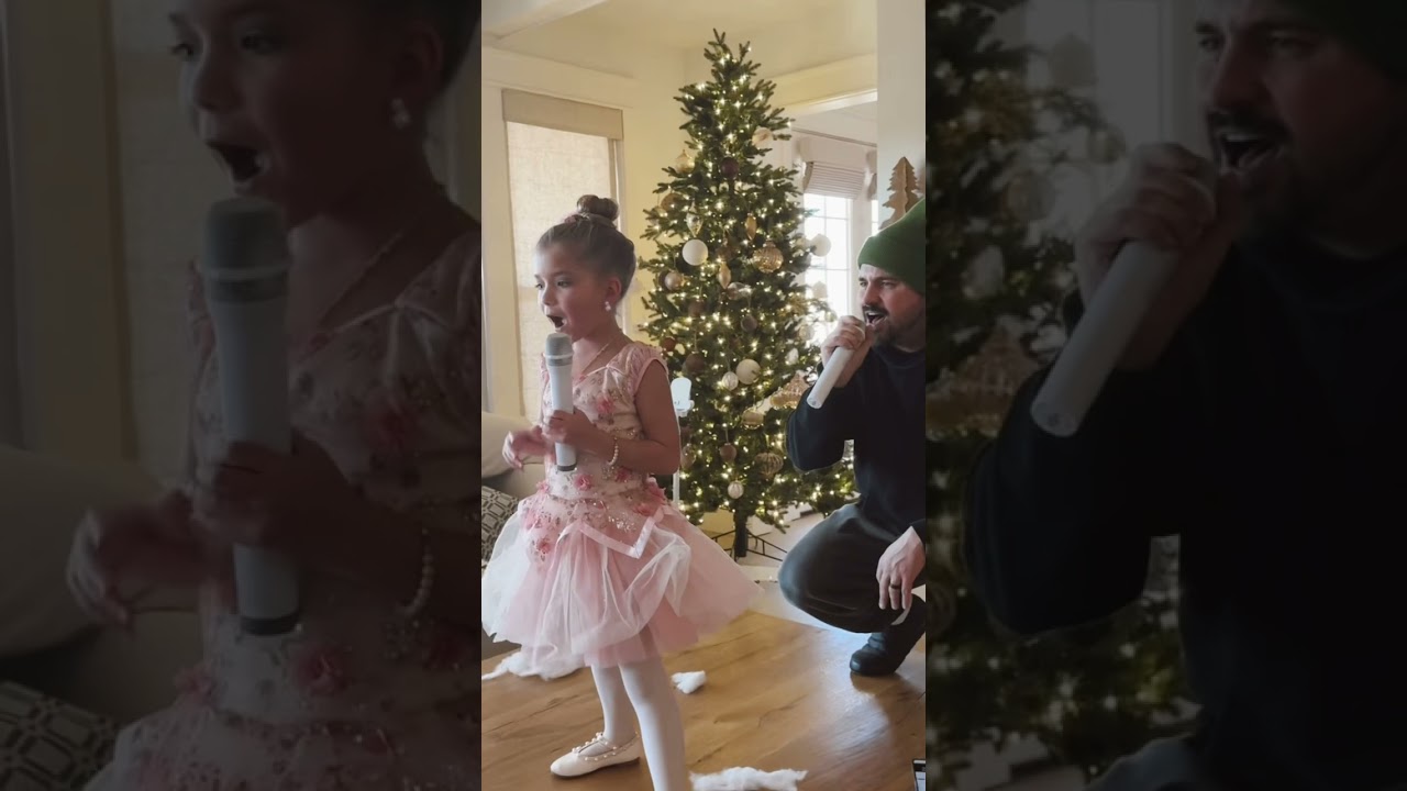 Father and daughter perform a fun festive holiday karaoke duet