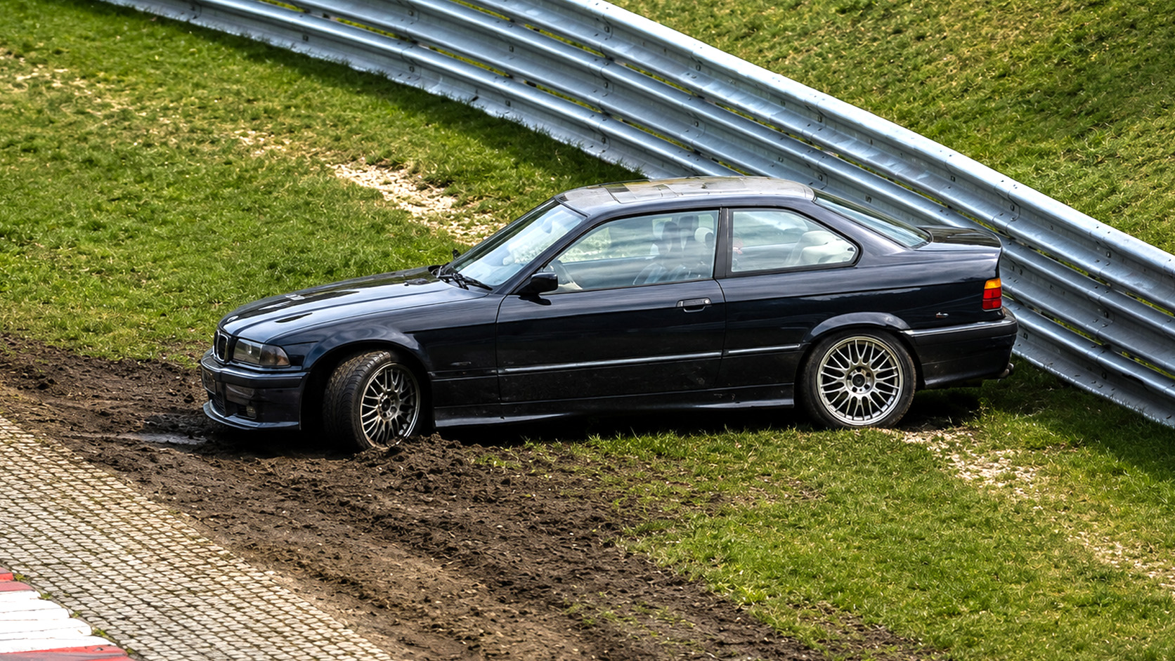 BMW slides violently off track creating a dangerous close call with the ...