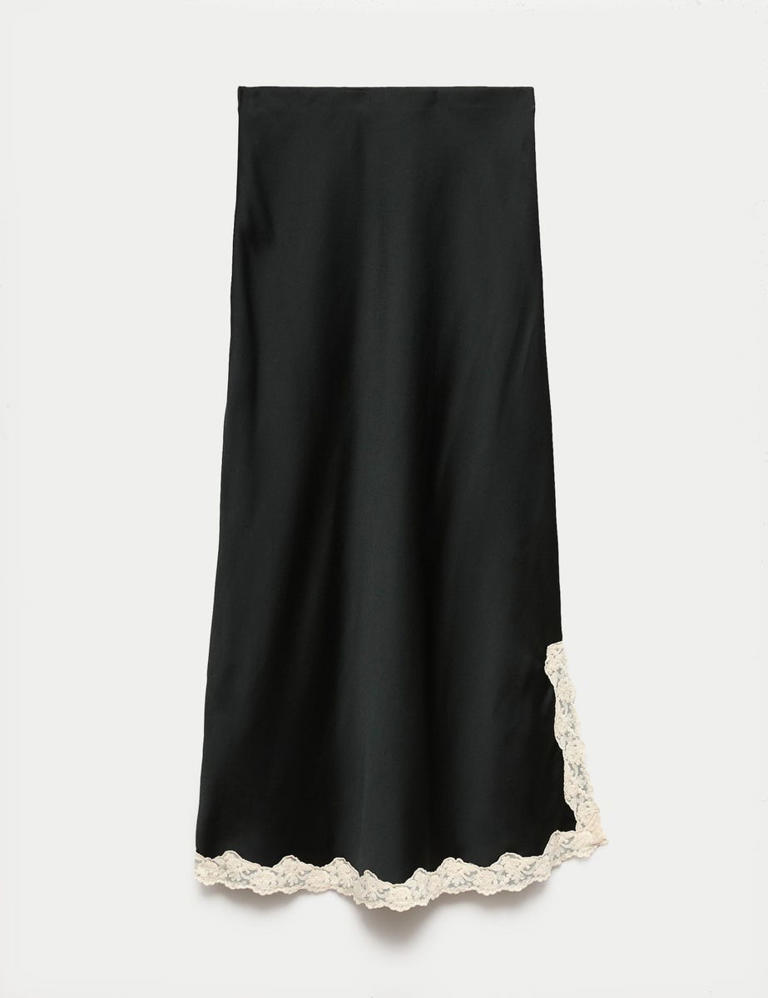 Black midi skirts are trending for summer – and Zara's fringed style ...