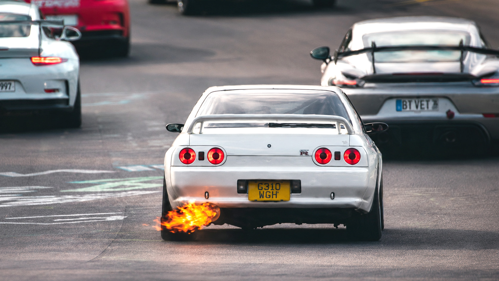 Nissan GT-R R32 pops flames while chasing another car at the Nürburgring