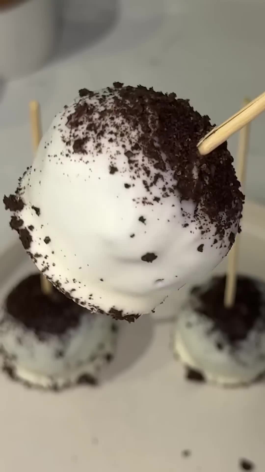 Cookie-based cake balls get a chocolate coating for party-ready treats