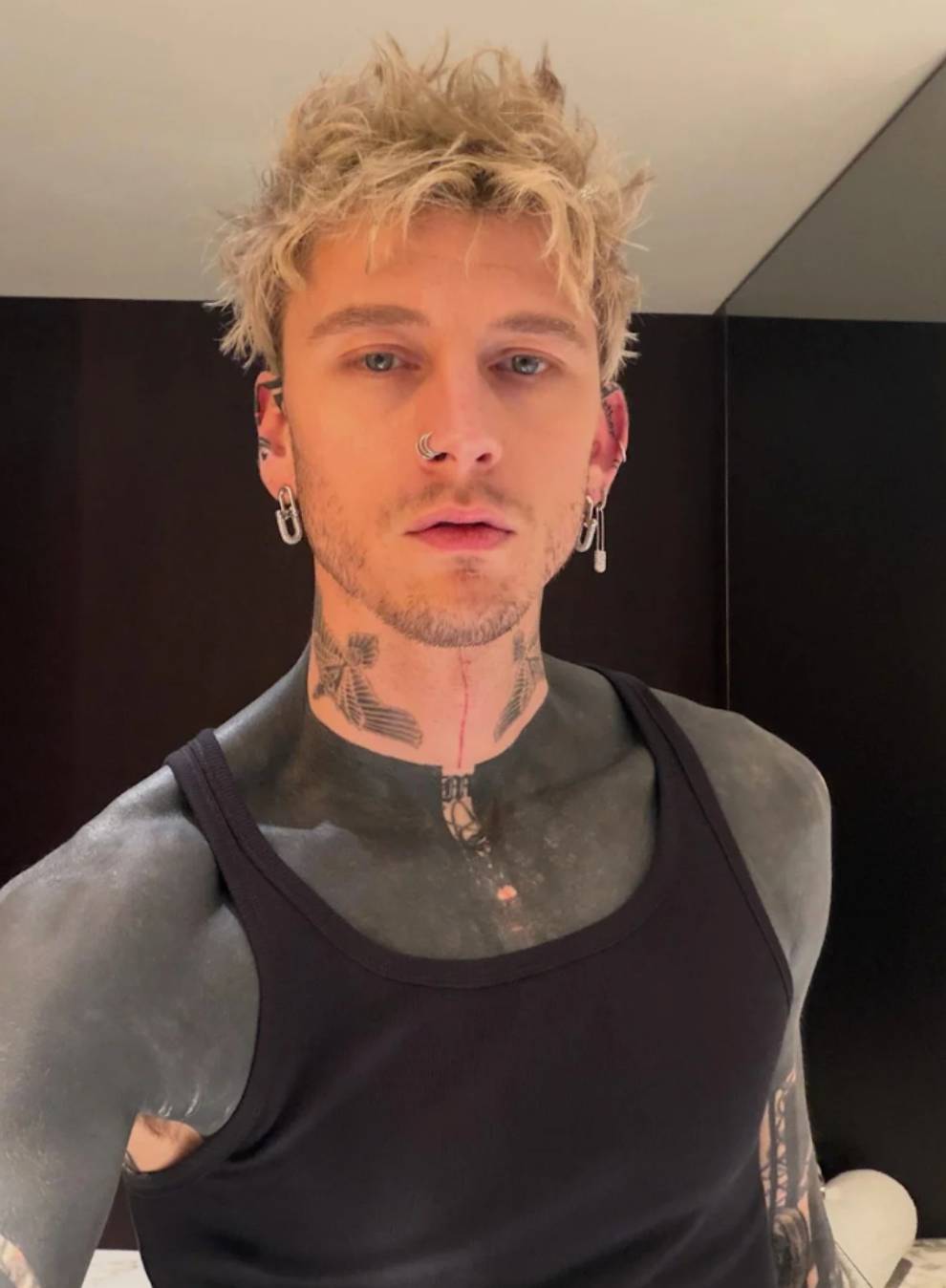 Machine Gun Kelly shared reason for covering body in blacked out tattoo ...