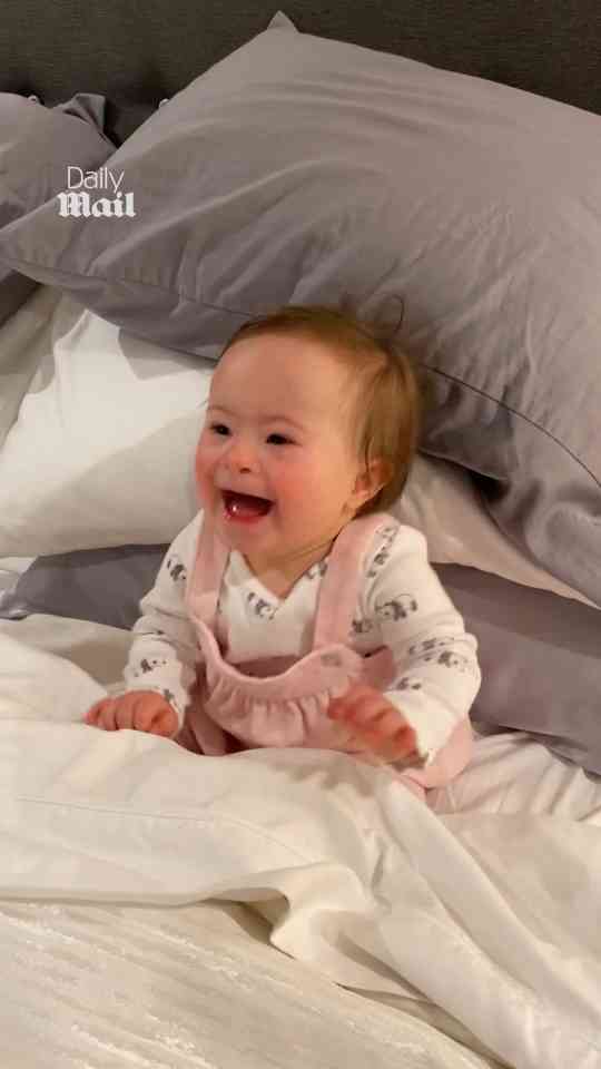 Baby with Down syndrome can't stop laughing with dad