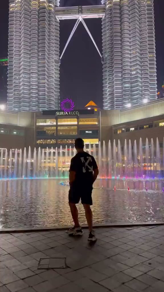Night at Petronas Towers with dazzling KLCC fountain show