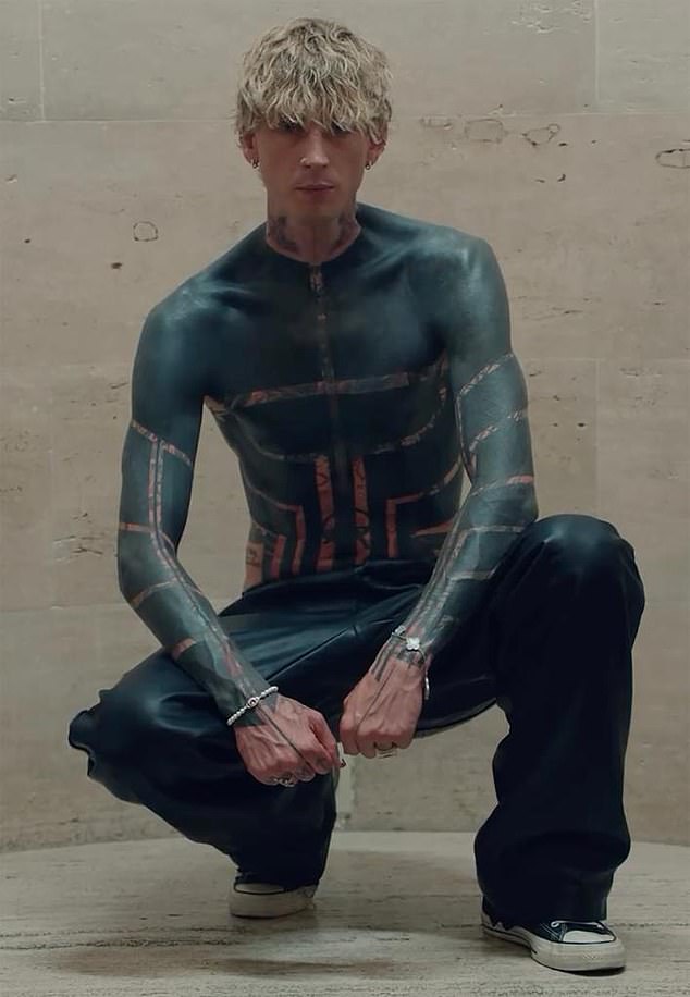 Machine Gun Kelly shares intense physical toll of his blackout tattoo