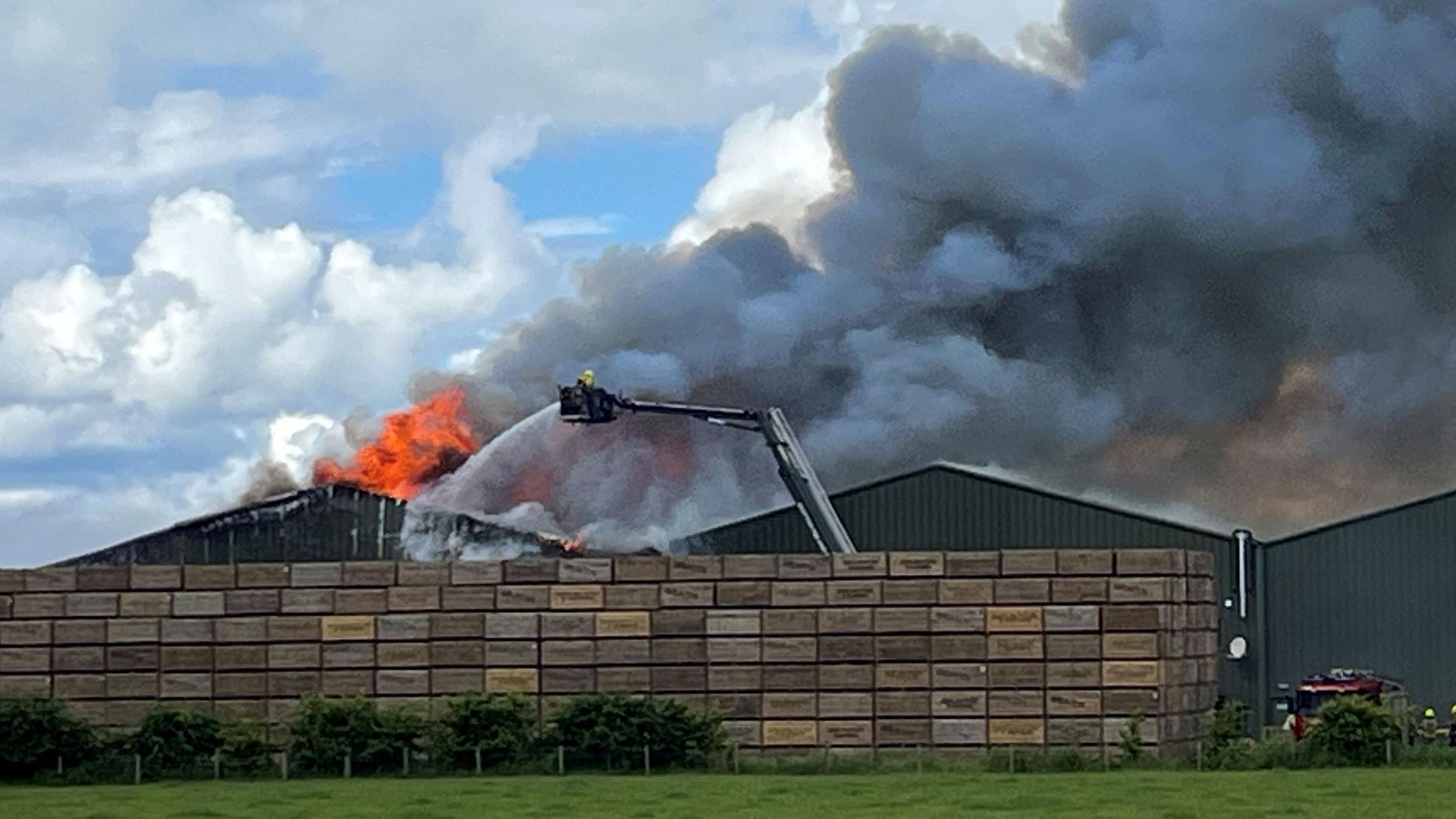 Firefighters tackle blaze in large farm building in Easter Ross