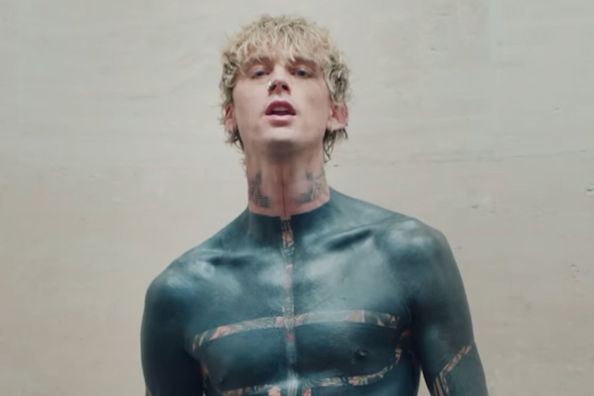 Machine Gun Kelly reveals scary side effects of massive blackout tattoo ...
