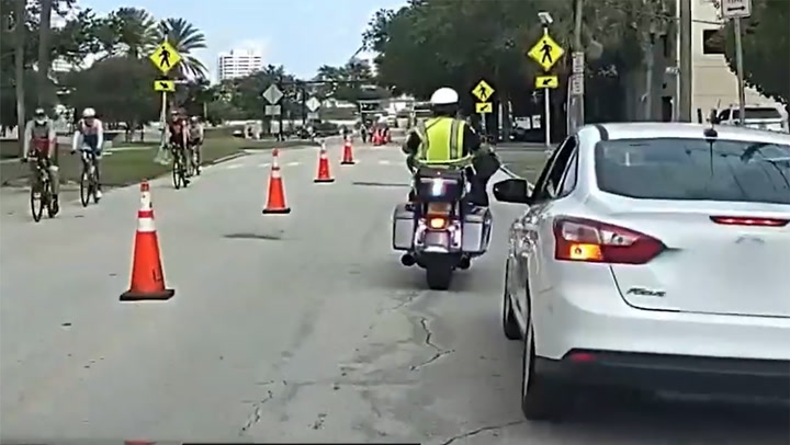 Caught on camera: Reported drunk driver speeds through Ironman race ...
