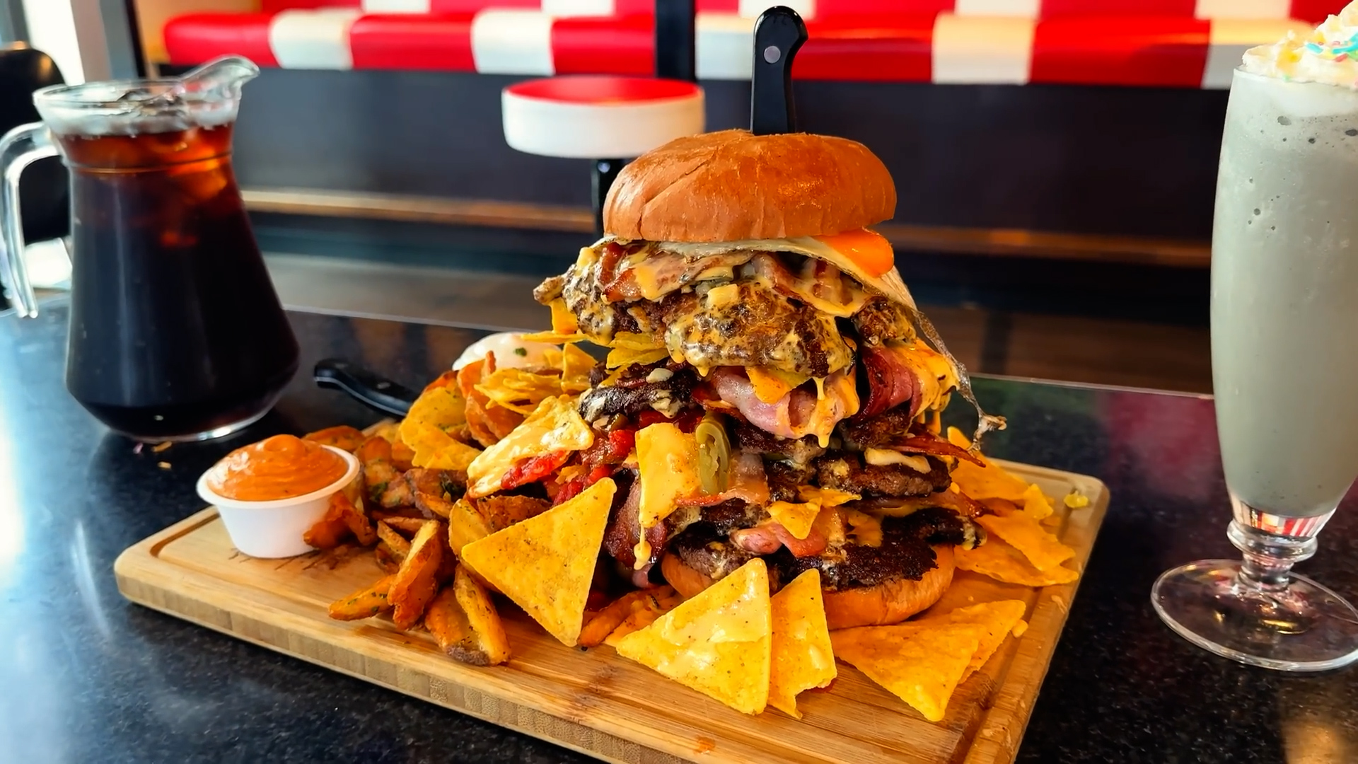 Man tries to finish Finland’s craziest burger loaded with chips, eggs ...
