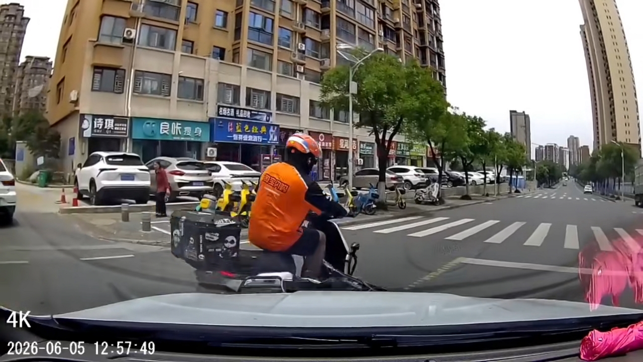 Dashcam captures close call between turning car and motorcycle