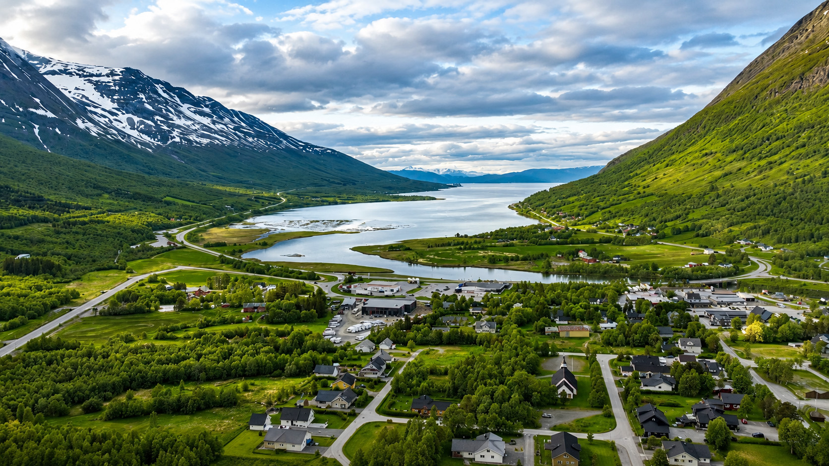 A hidden fjord valley surrounded by towering mountain walls