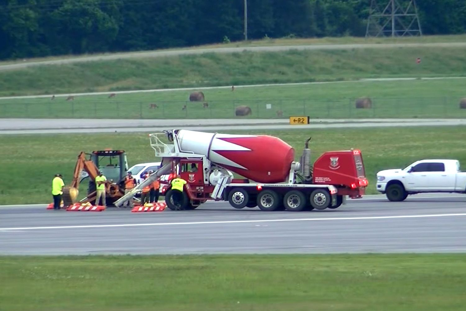 Sinkhole 20 feet wide and 17 feet deep opens up on airport runway in ...