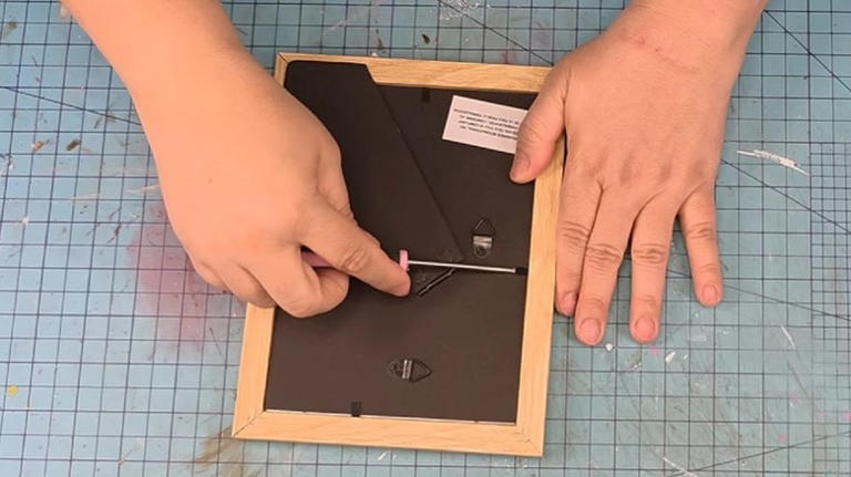 DIYer grabs Dollar Tree picture frames to create adorable storage