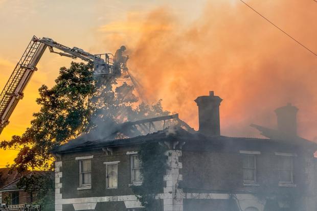 Fire tears through historic home set to be ripped down for housing