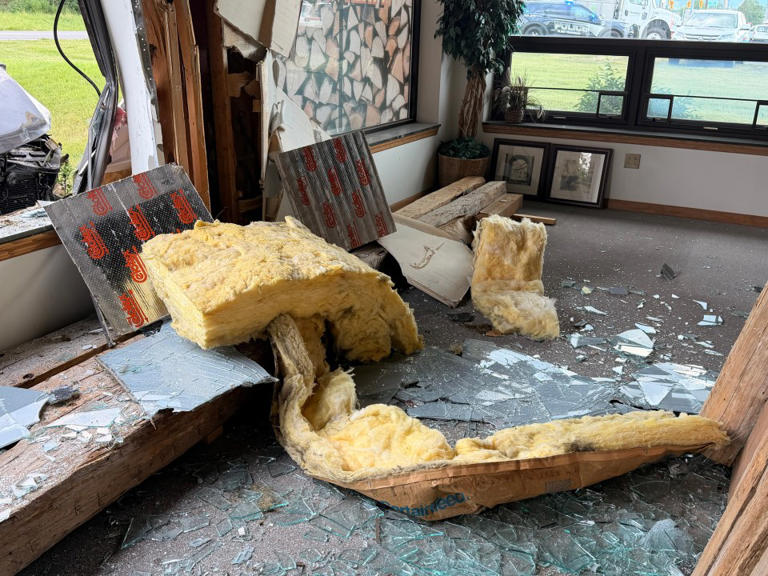 One taken to hospital after car crash into Blair County business