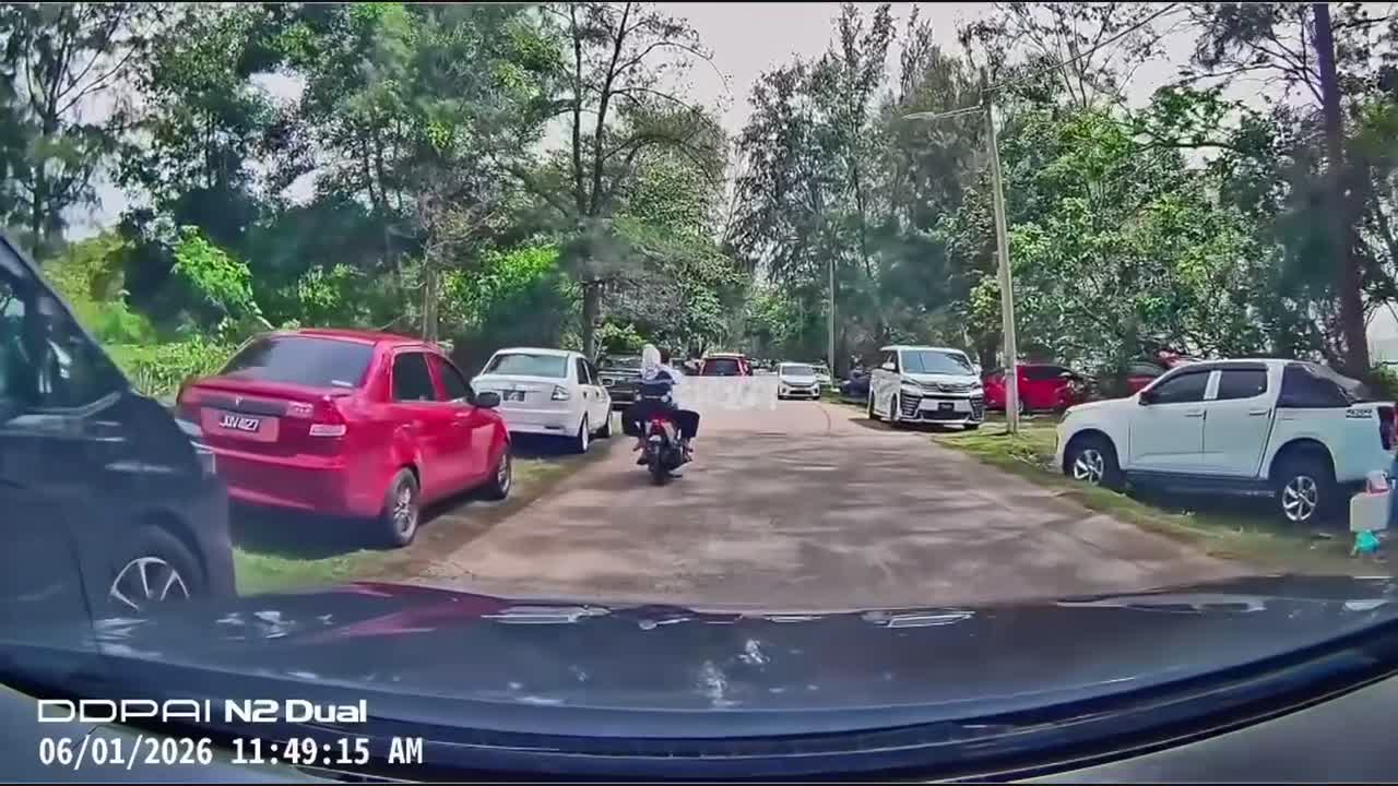 Car tips forward when driver accidentally veers onto roadside slope