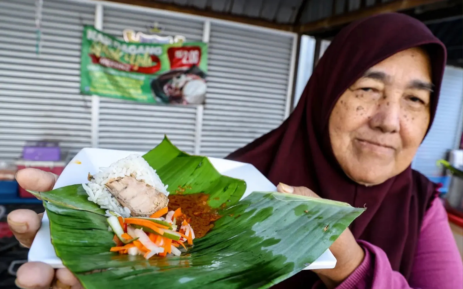 Mak Yah still sells her nasi dagang for RM2