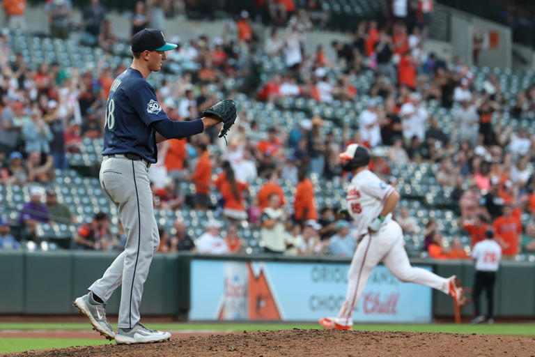 Holliday hits grand slam and Young pitches Orioles past Mariners 7-2 to ...
