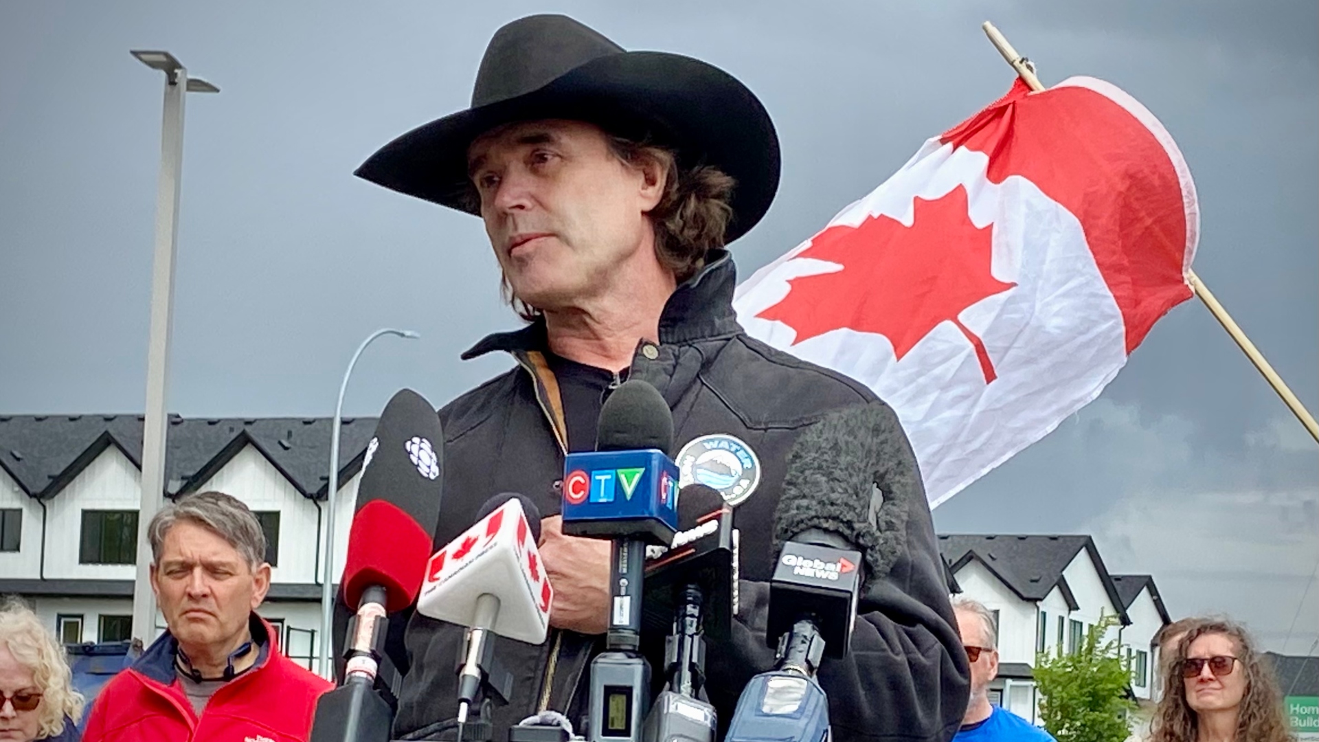Corb Lund delivers 'Water Not Coal' petition to Elections Alberta