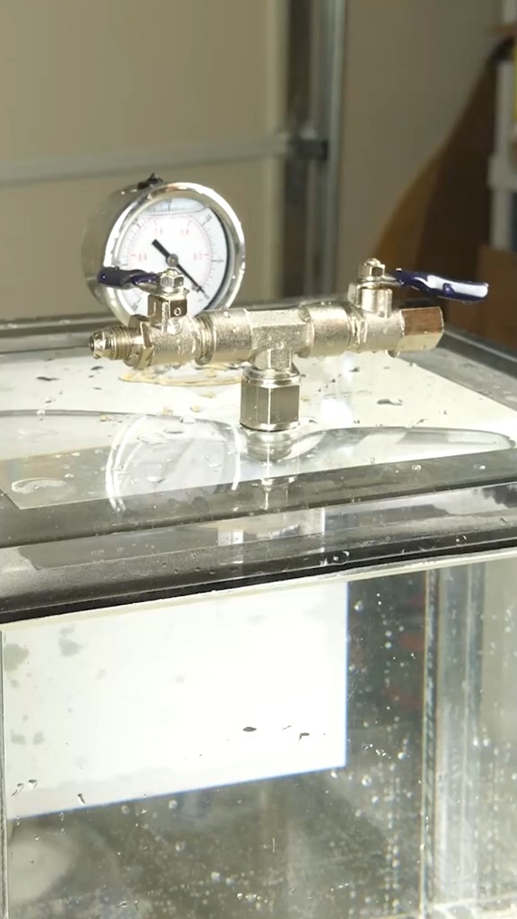 Opening a vacuum chamber under water!