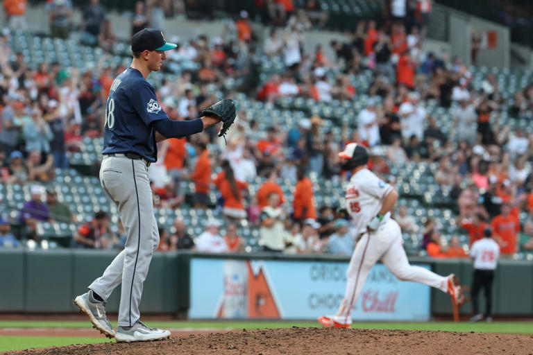 Holliday hits grand slam and Young pitches Orioles past Mariners 7-2 to ...