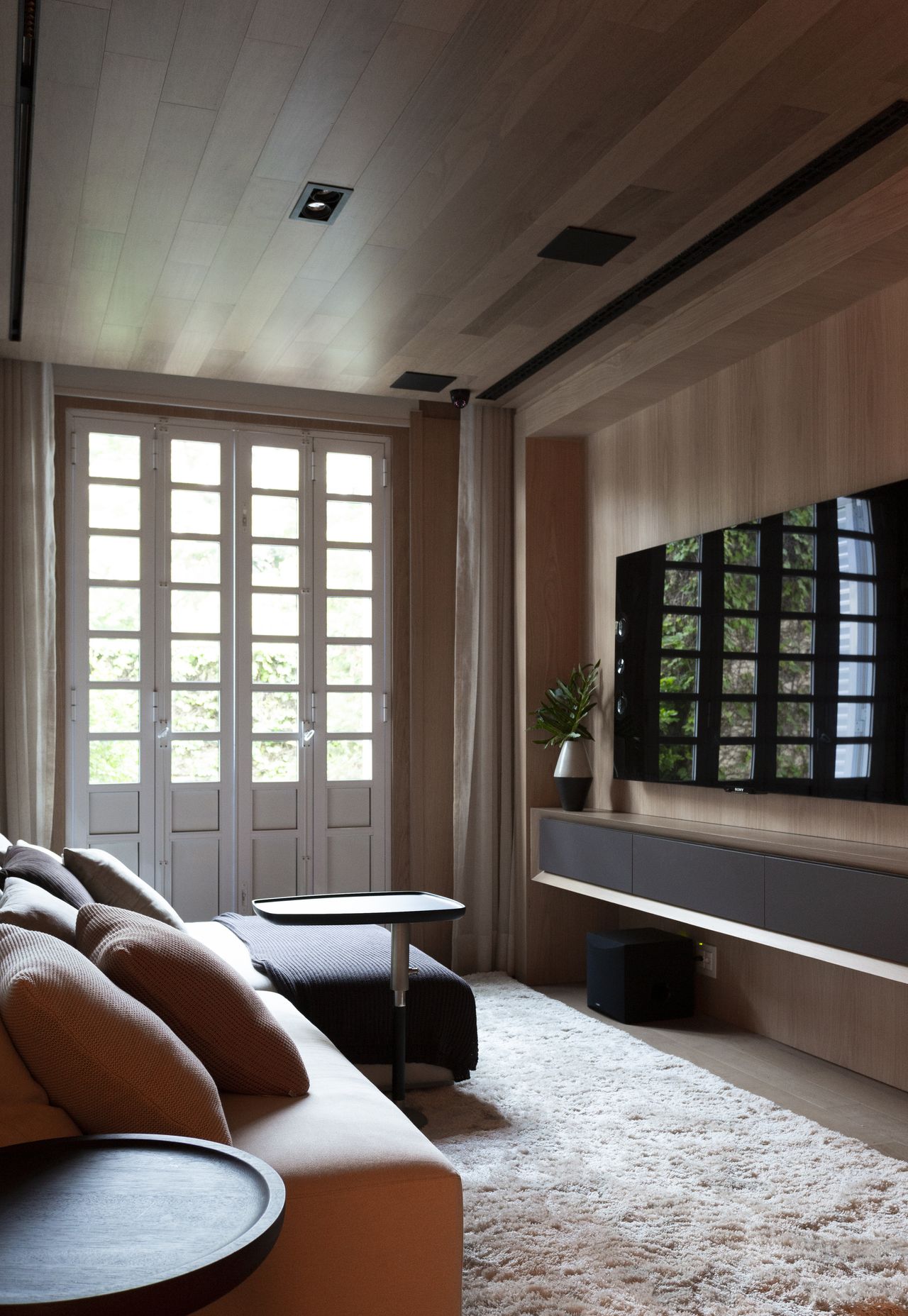 Designers share where to put a TV in a small living room without ruining it