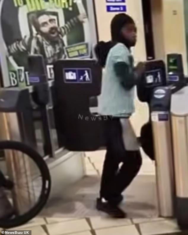 Fare dodging cyclist forces his way through wide gate at Tube station ...
