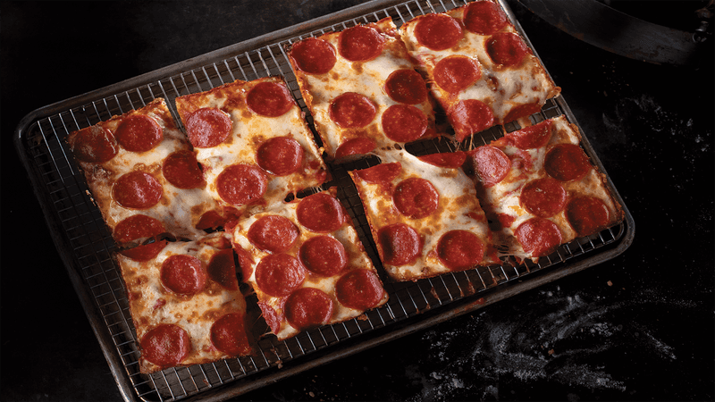 A Texas pizza shop serving square-cut pies and crispy edges