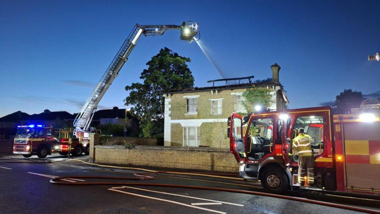 Roof collapses as fire engulfs derelict building