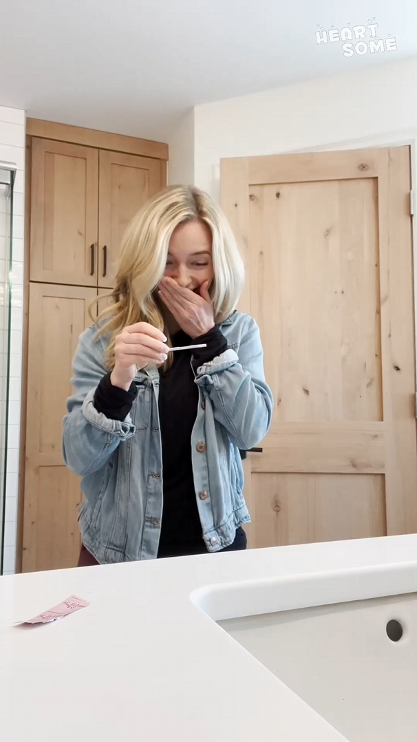 Woman in tears after seeing positive pregnancy test after long struggle