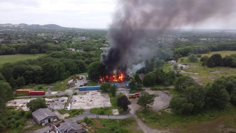 Drone footage shows huge blaze destroy abandoned Camelot theme park