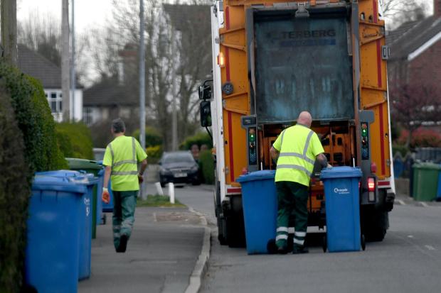 Rubbish tipped out onto street after fire breaks out inside bin lorry