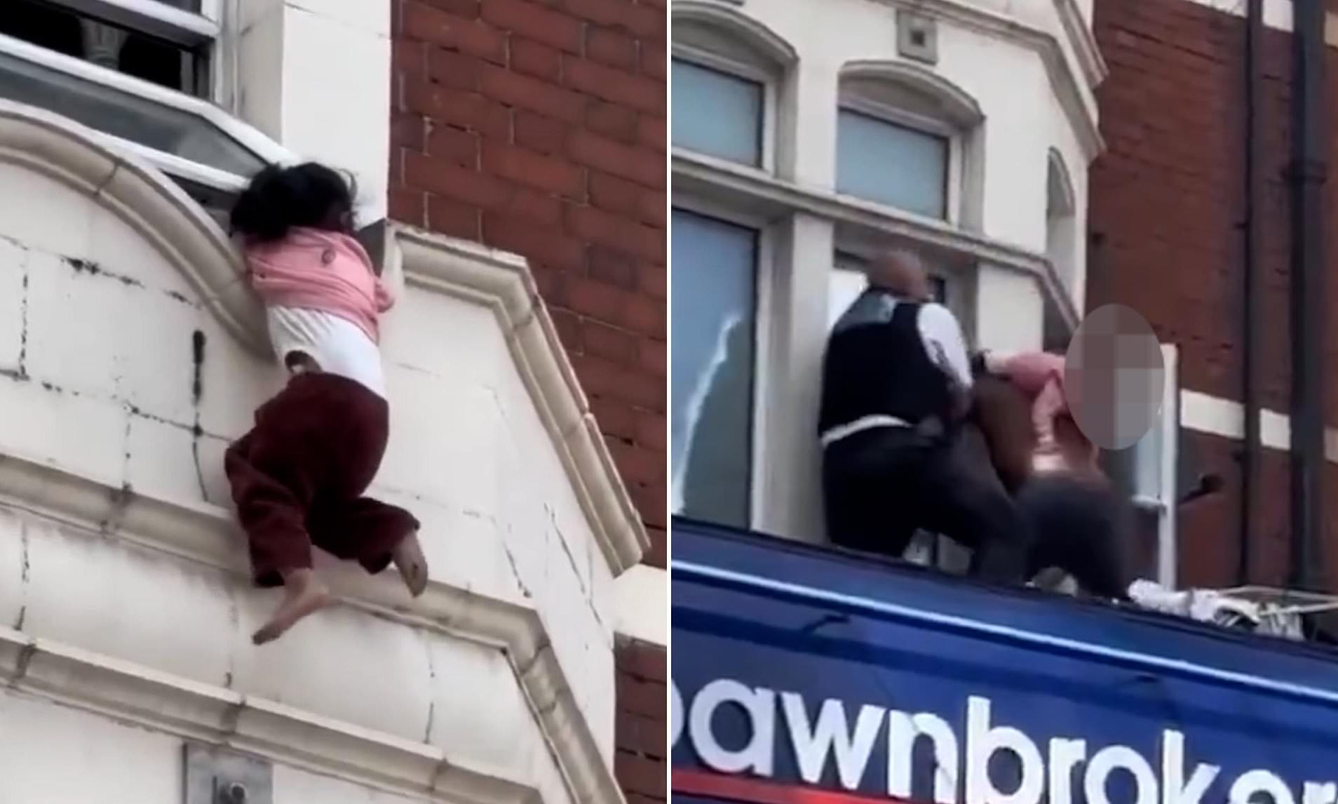 Moment young girl dangles from a window before being saved by a police ...