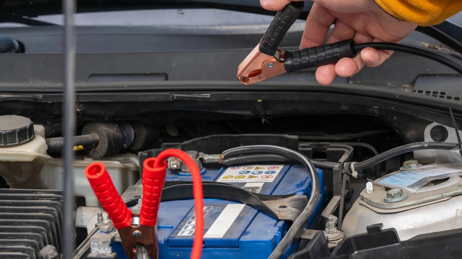 Changing a car battery starts with the negative terminal, not the red one