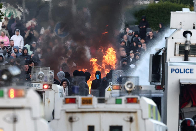 Firefighters start fighting while dealing with Belfast riots