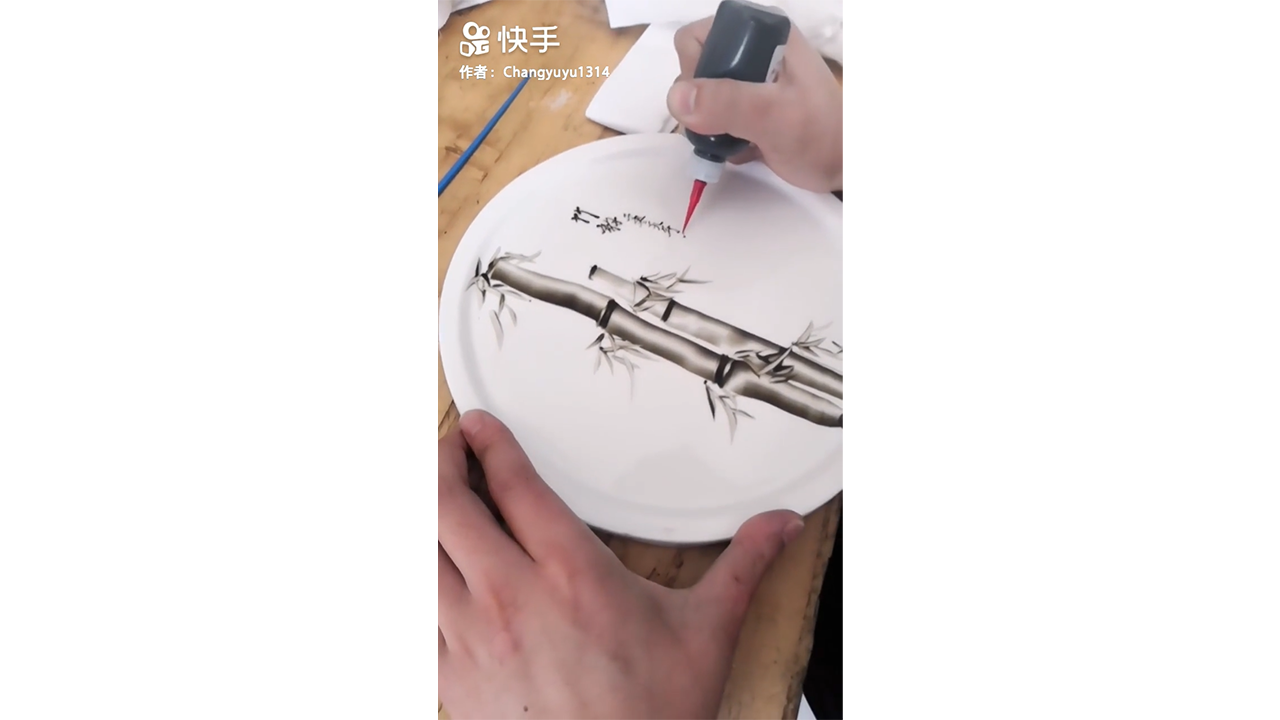 Traditional bamboo ink painting on ceramic plate with soft shading and ...