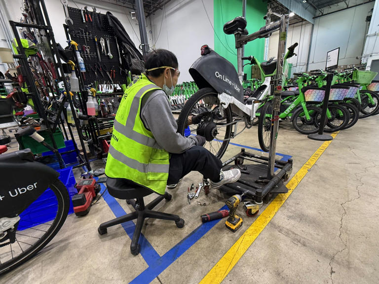 Inside Lime’s Seattle warehouse, where 15,000 bikes and scooters are ...