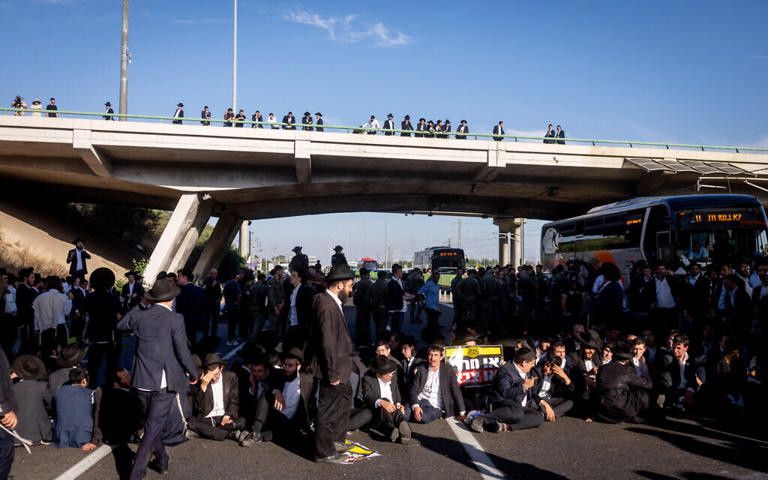 Thousands of Haredi protesters block traffic on central Israel ...